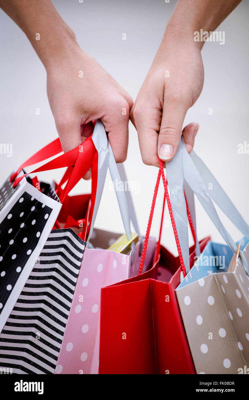 Close-up of two women carrying shopping bags Stock Photo - Alamy