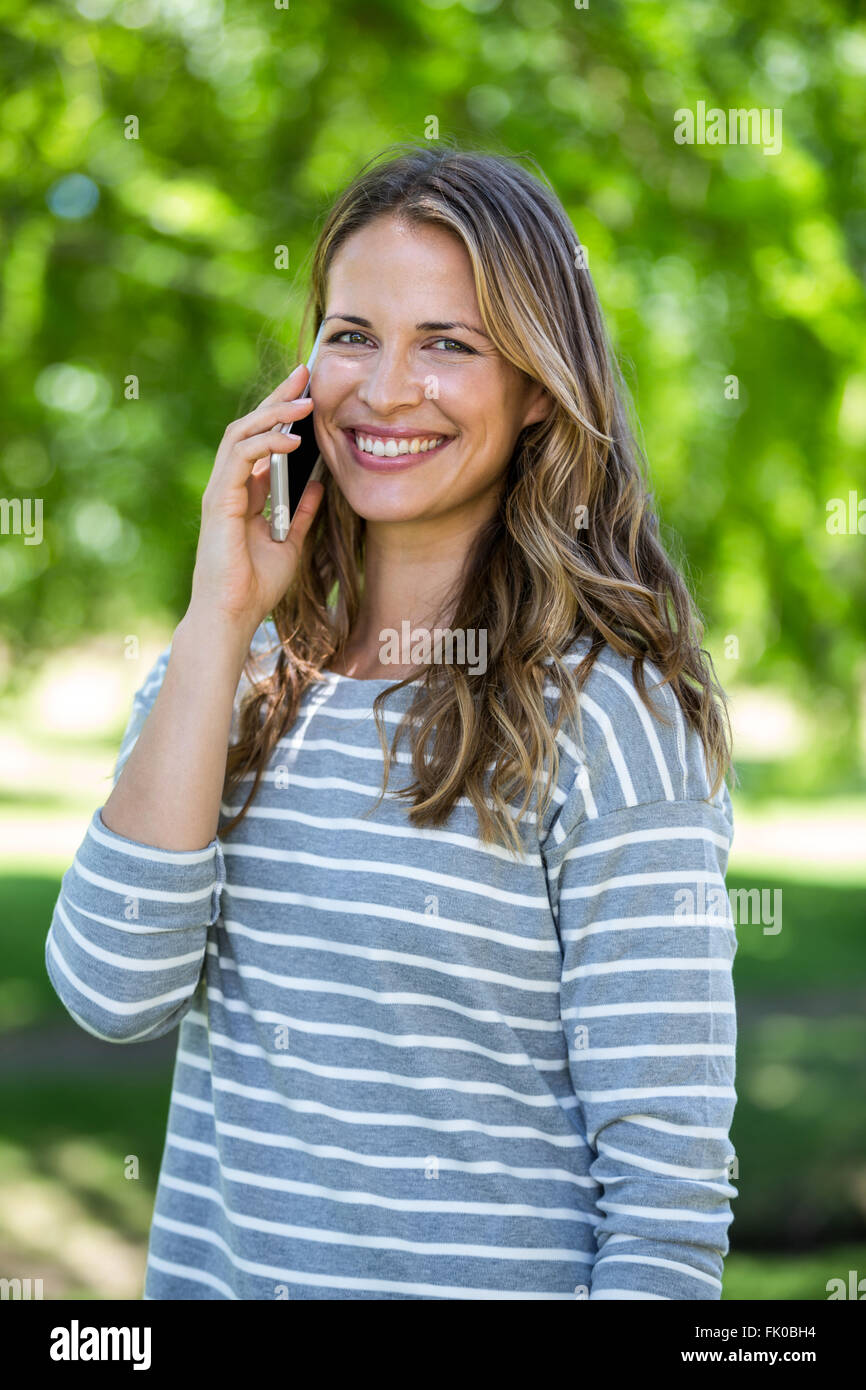 Smiling female smartphone making hi-res stock photography and images ...
