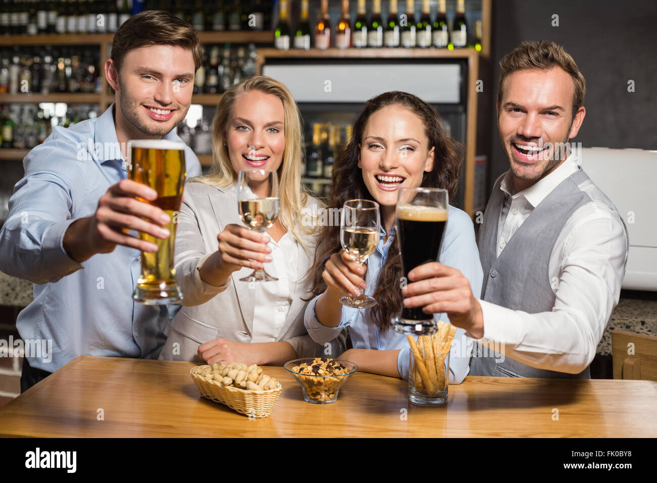 Friends toasting with beverages Stock Photo - Alamy