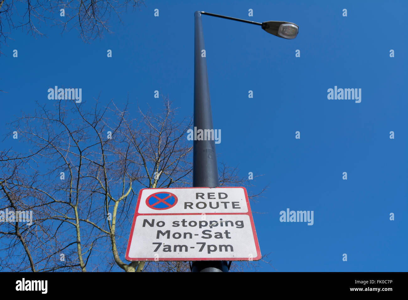 british road sign marking a red route with no stopping times Stock ...
