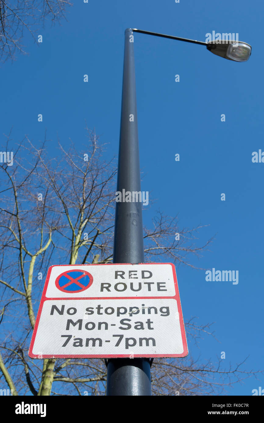 british road sign marking a red route with no stopping times Stock ...