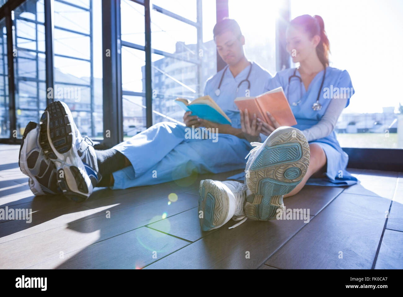 Medical team reading book hi-res stock photography and images - Alamy