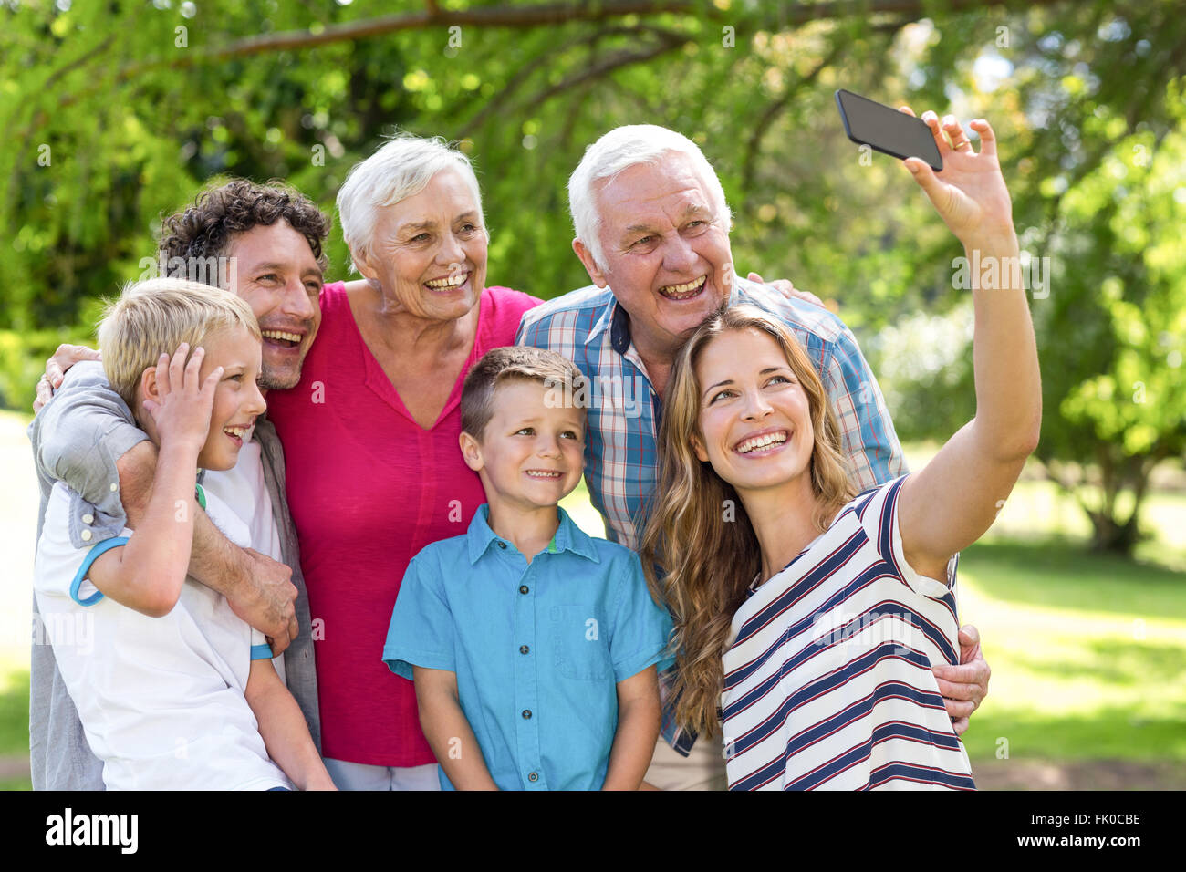 Smiling family taking selfie Stock Photo - Alamy