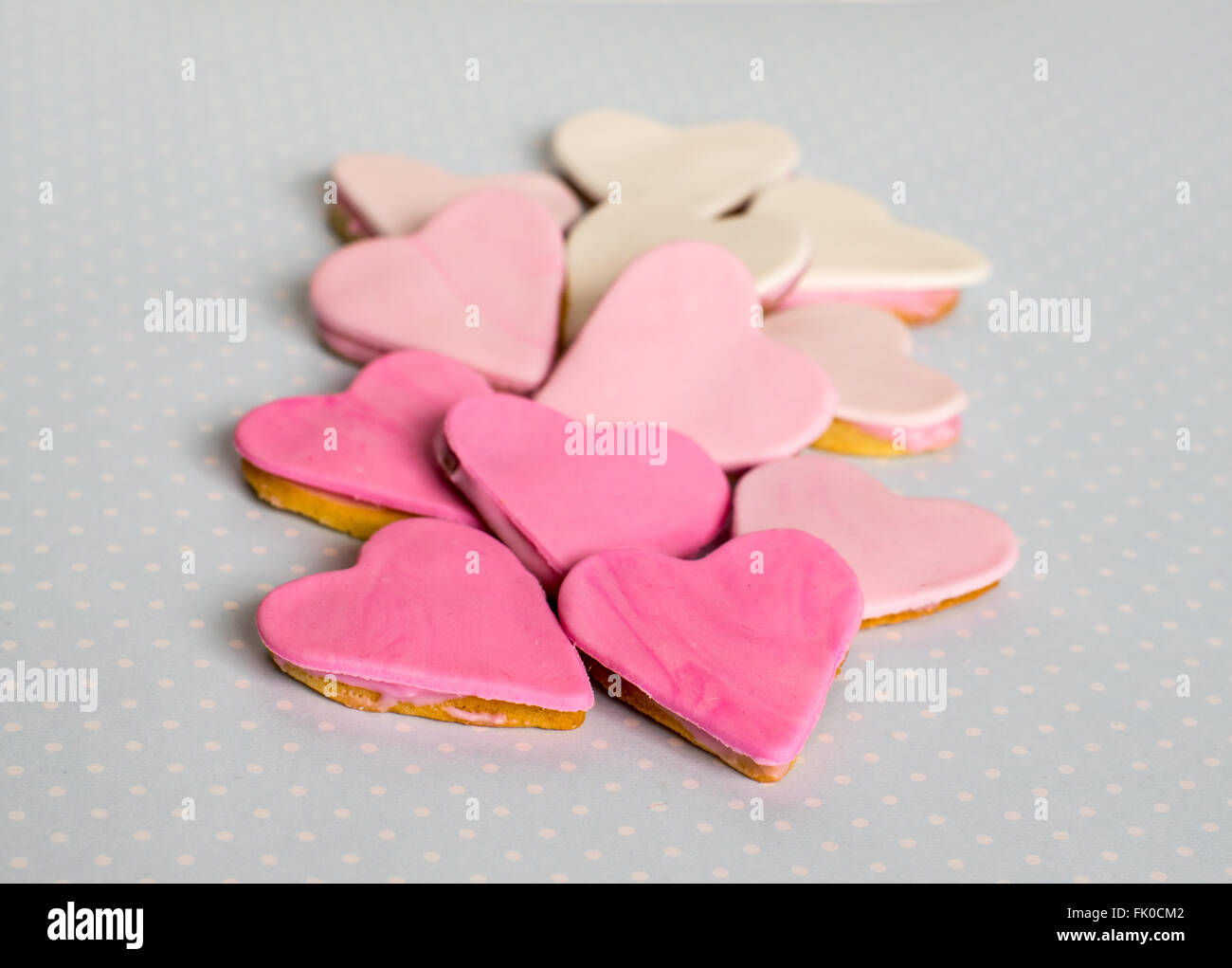 Pink cookies, heart shape, blue background Stock Photo - Alamy