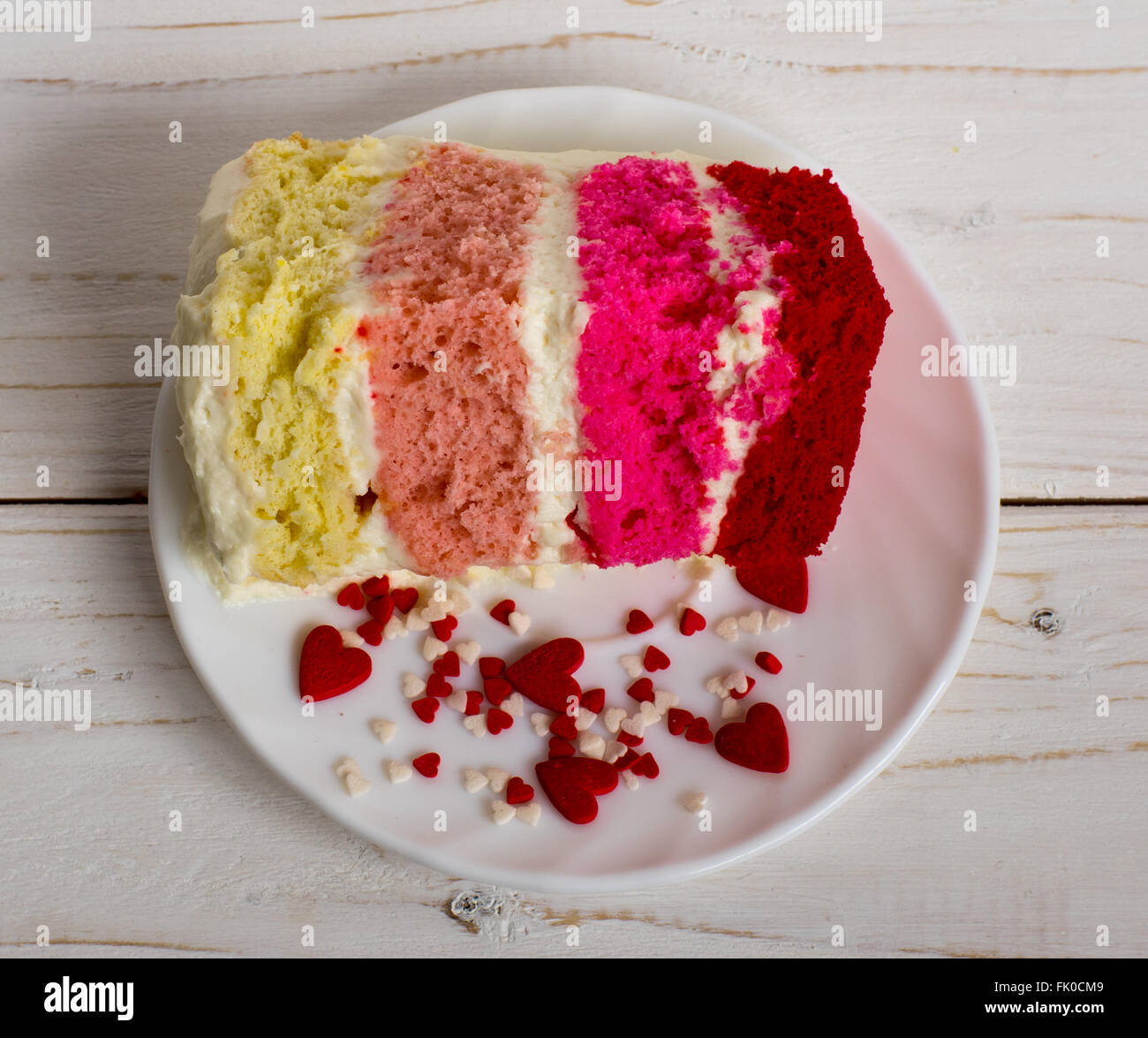Multicolor cake on the plate for Valentine Day Stock Photo - Alamy
