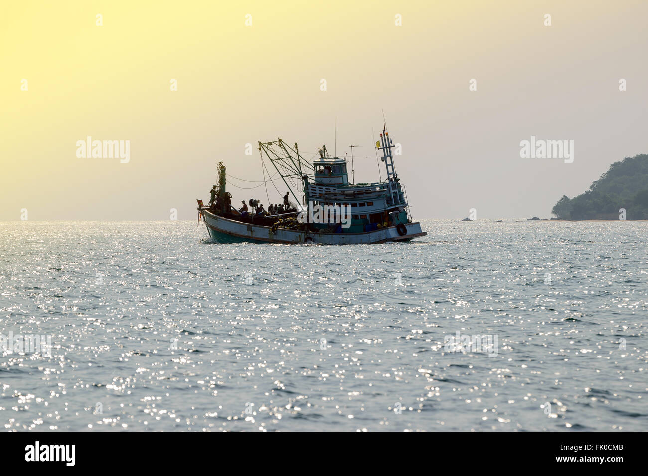 Fishing boats floating in the sea Stock Photo - Alamy