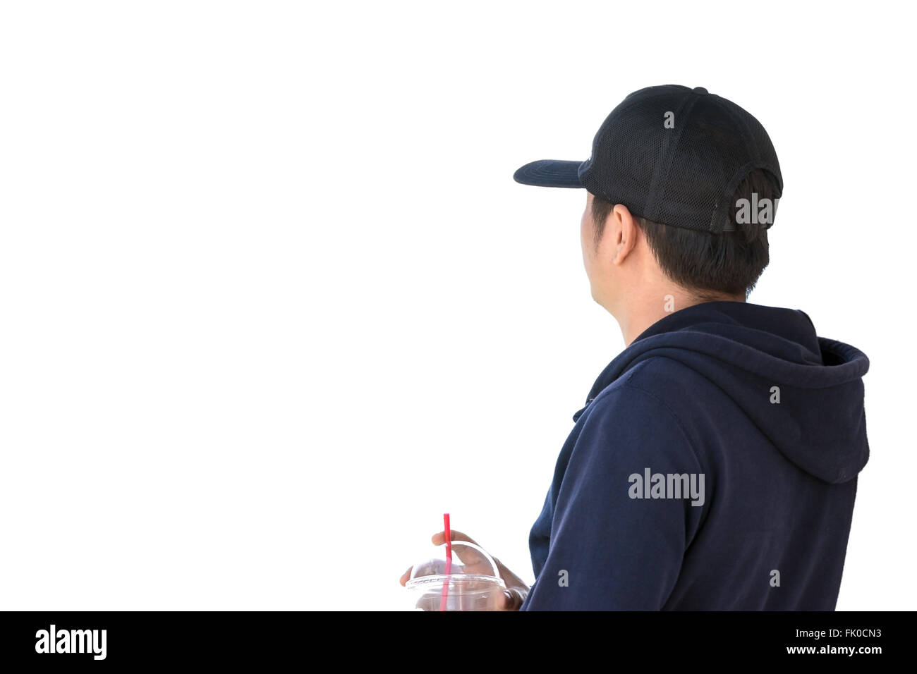Back view of young man wearing a black cap and long sleeve blue ...