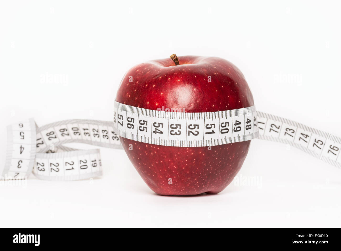 Healthy red apple with measuring tape isolated on white background ...