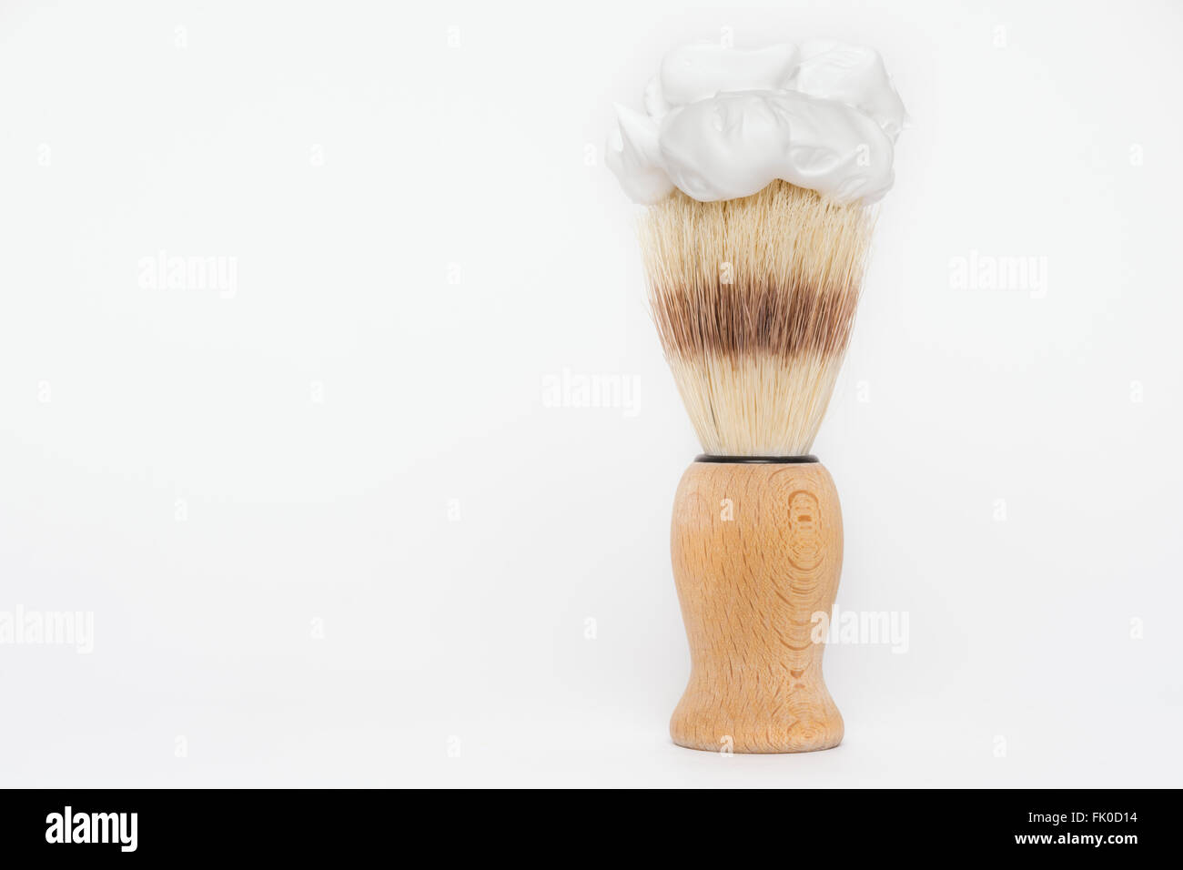 Wooden classic shaving brush with foam isolated on white background ...