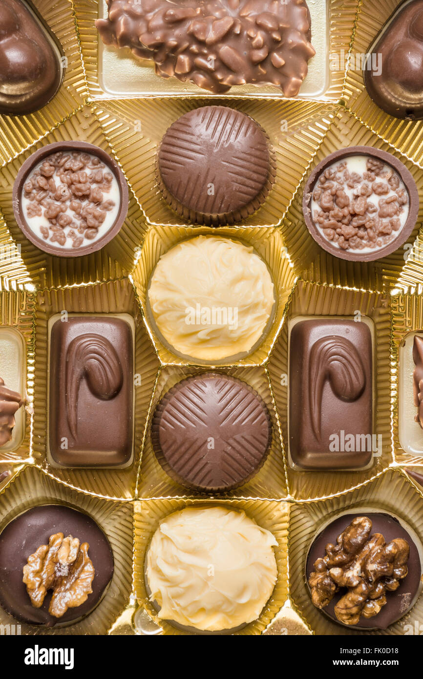 Chocolate pralines of various types in a box Stock Photo - Alamy
