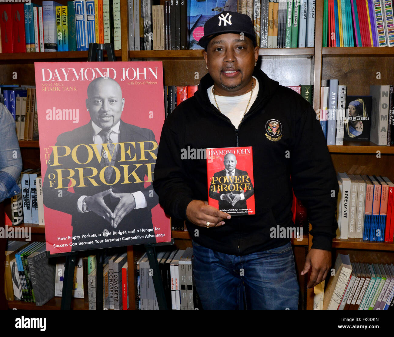 Daymond John greets fans and signs copies of his book 'The Power of ...