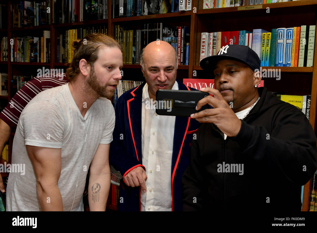 Daymond John greets fans and signs copies of his book 'The Power of ...