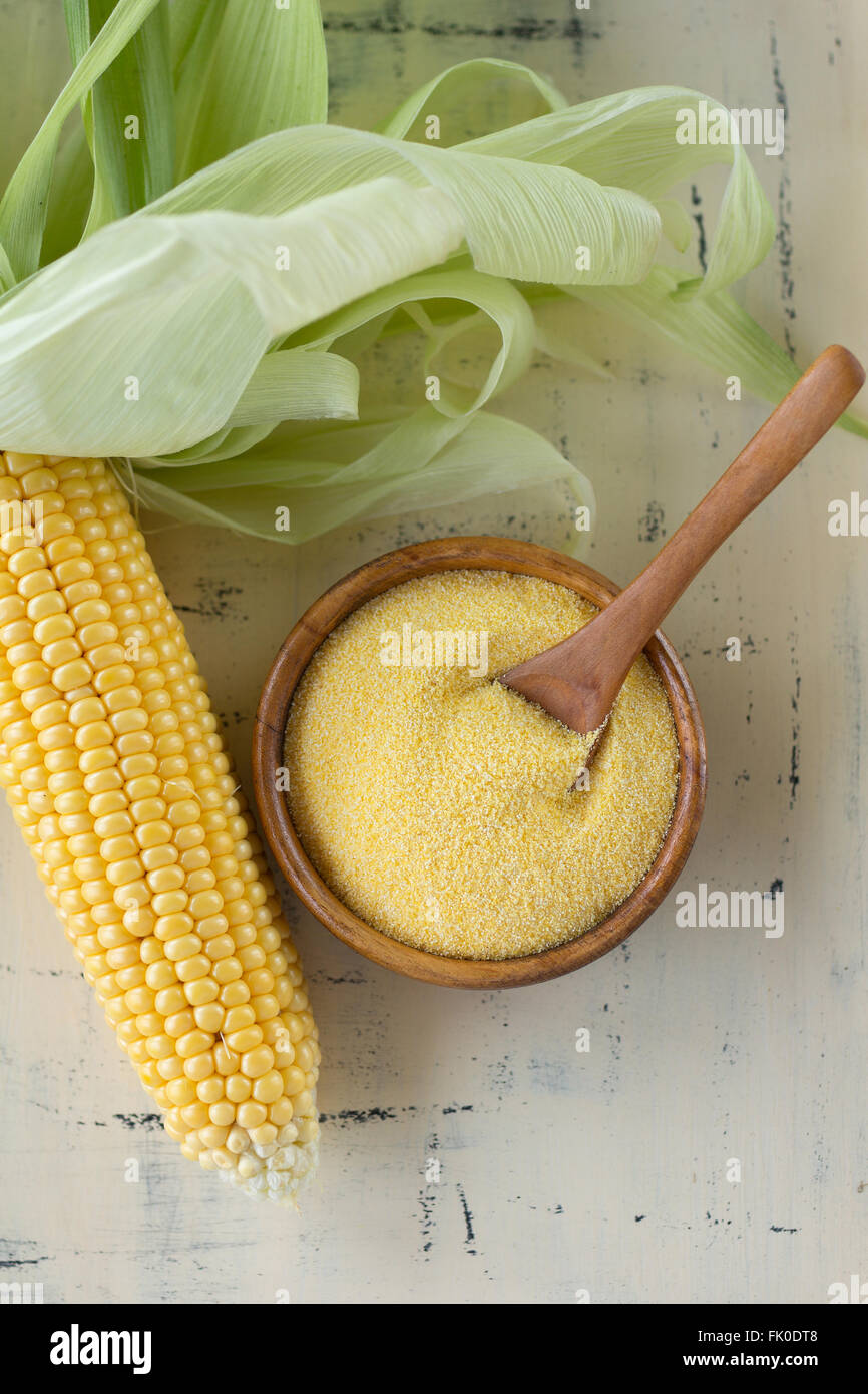 Bowl with polenta and corn on the cob on tray Stock Photo - Alamy