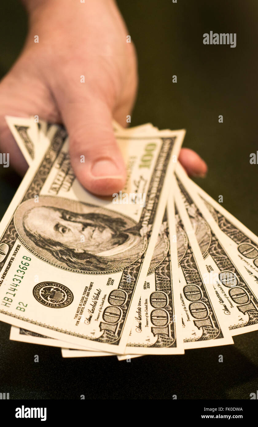 Hand With Hundreds Stock Photo - Alamy