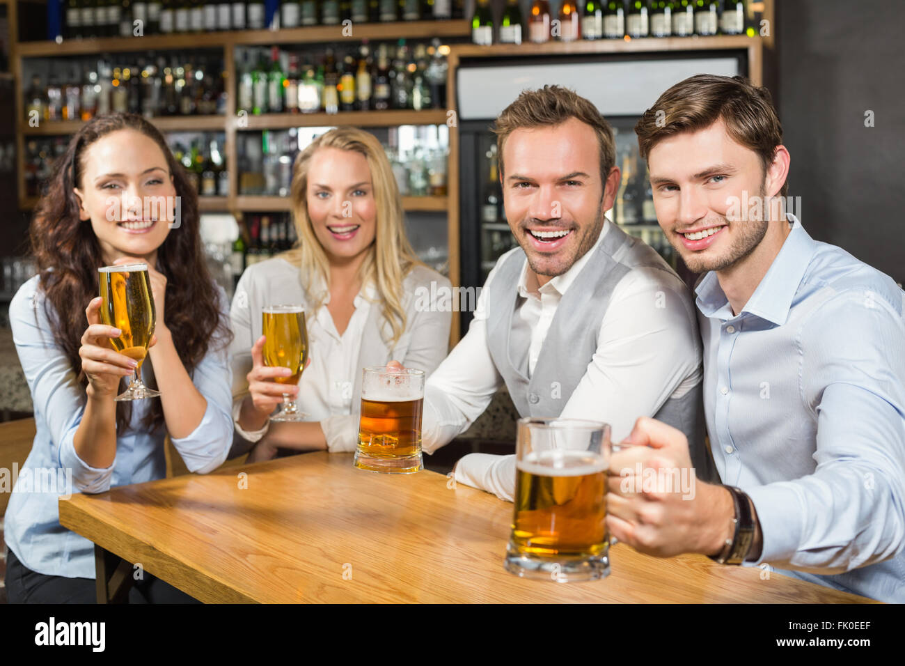 Friends toasting with beers Stock Photo - Alamy