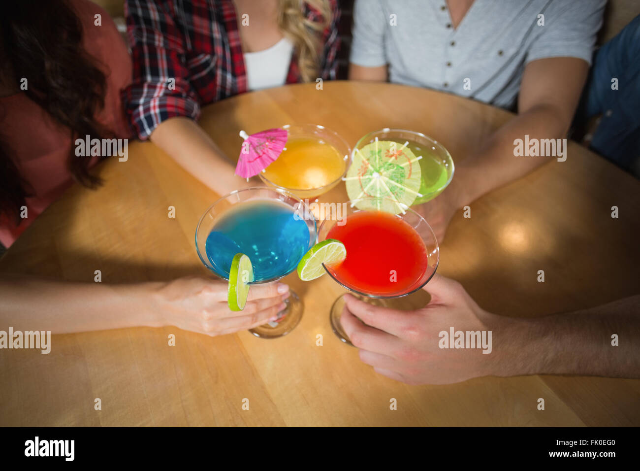 Friends toasting with cocktails Stock Photo - Alamy