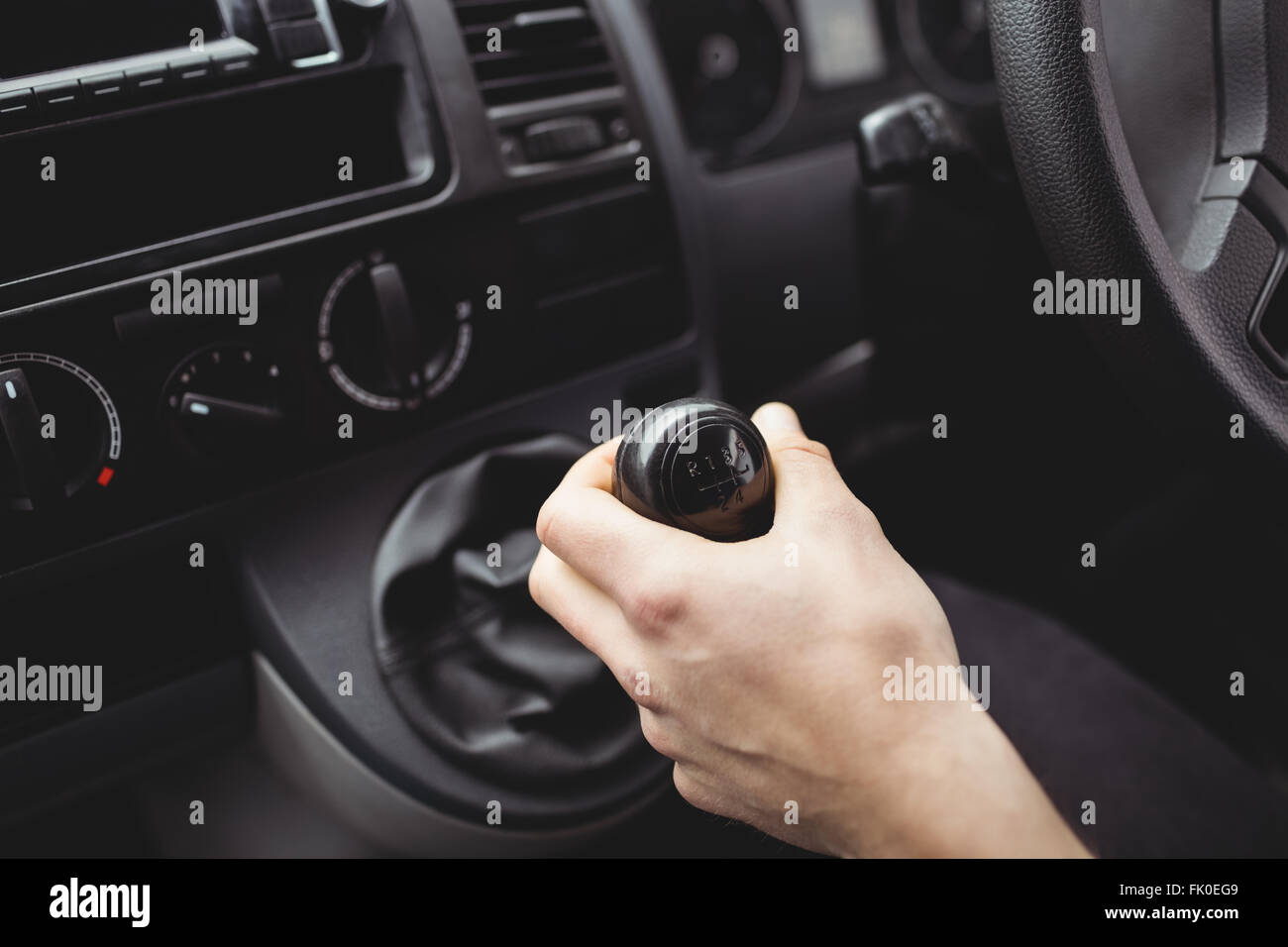 Man using gear change Stock Photo - Alamy