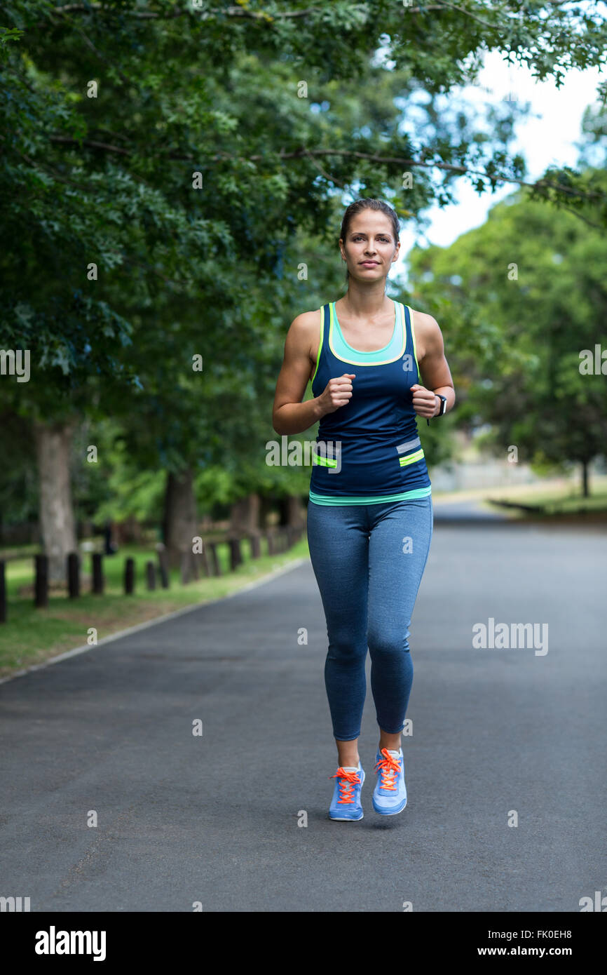 Marathon female athlete running Stock Photo - Alamy