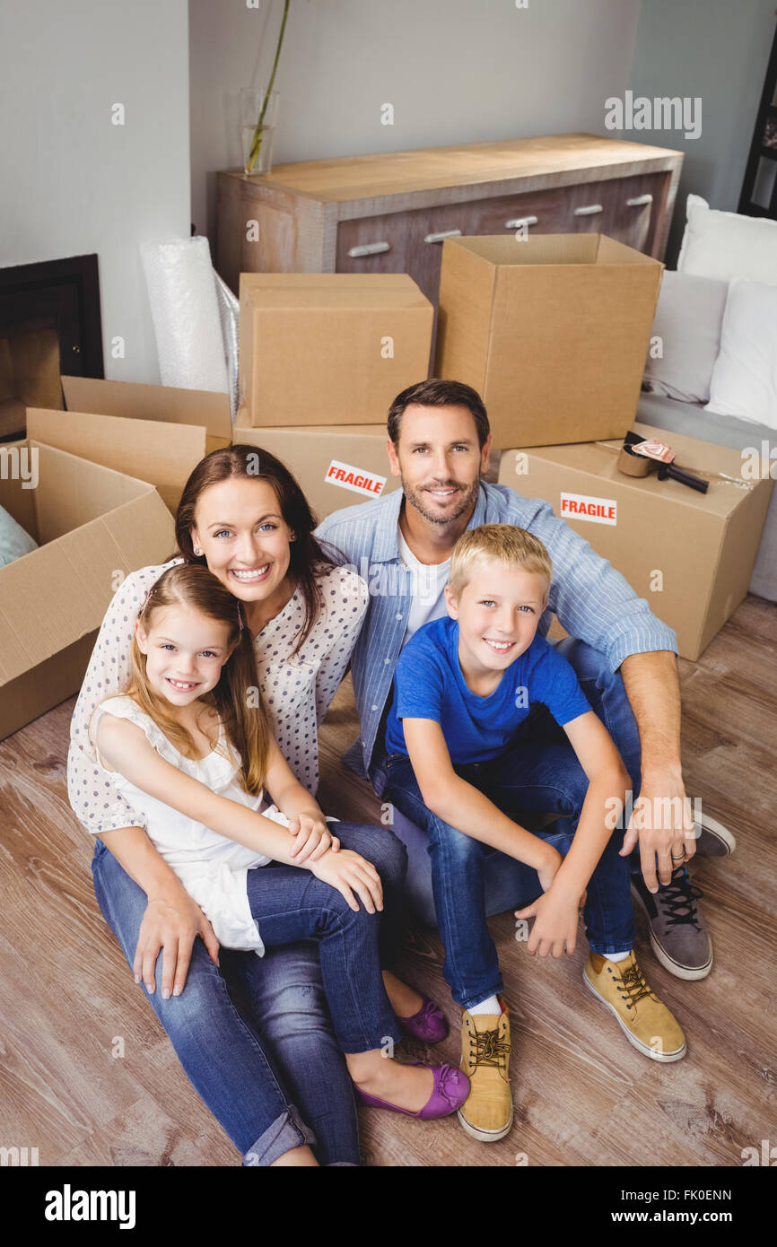 High angle portrait of smiling family with cardboard boxes Stock Photo ...