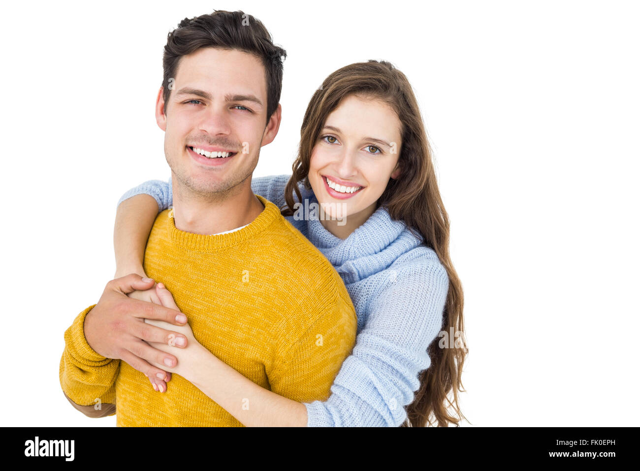 Happy couple embracing and looking camera Stock Photo - Alamy