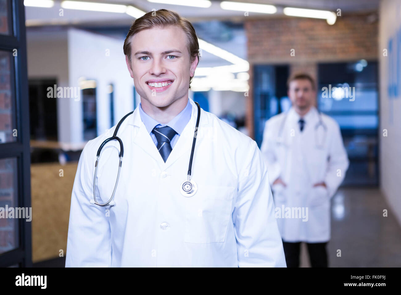 Doctor smiling in hospital Stock Photo - Alamy