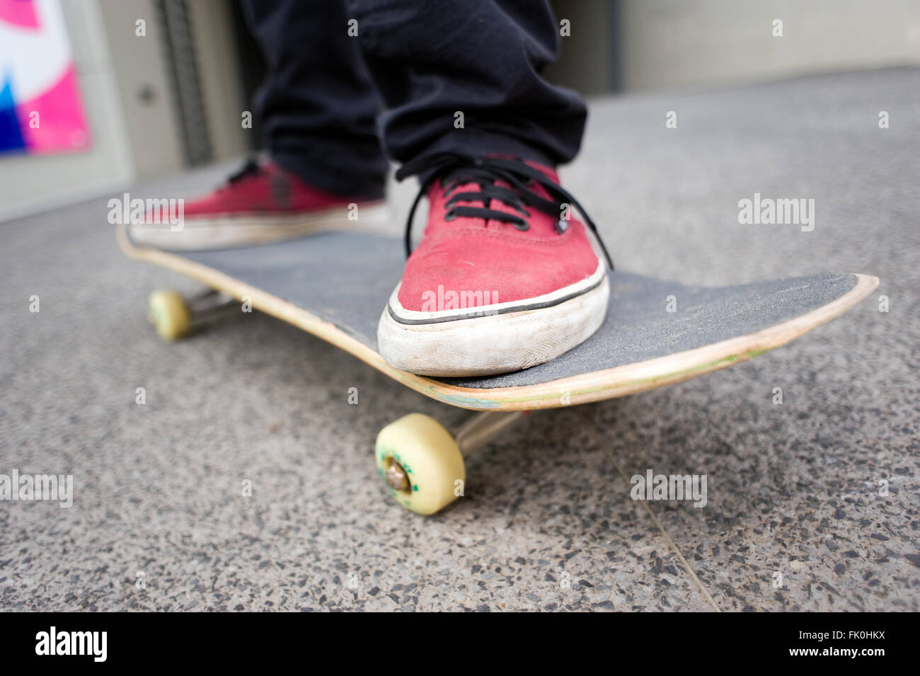 Skater in red snickers on the skateboard Stock Photo - Alamy