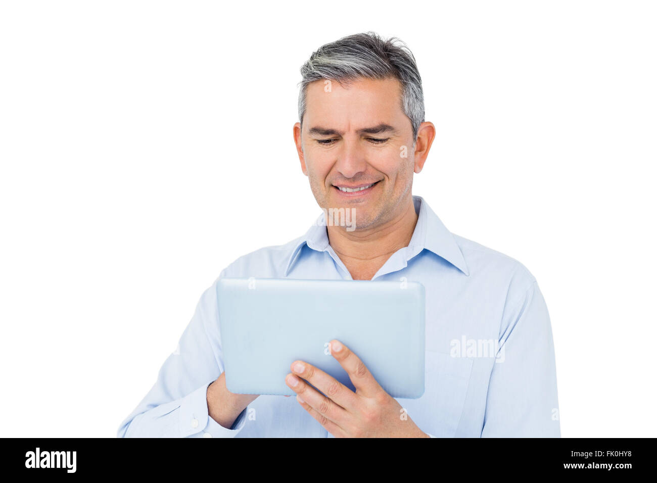 Smiling businessman using tablet Stock Photo - Alamy