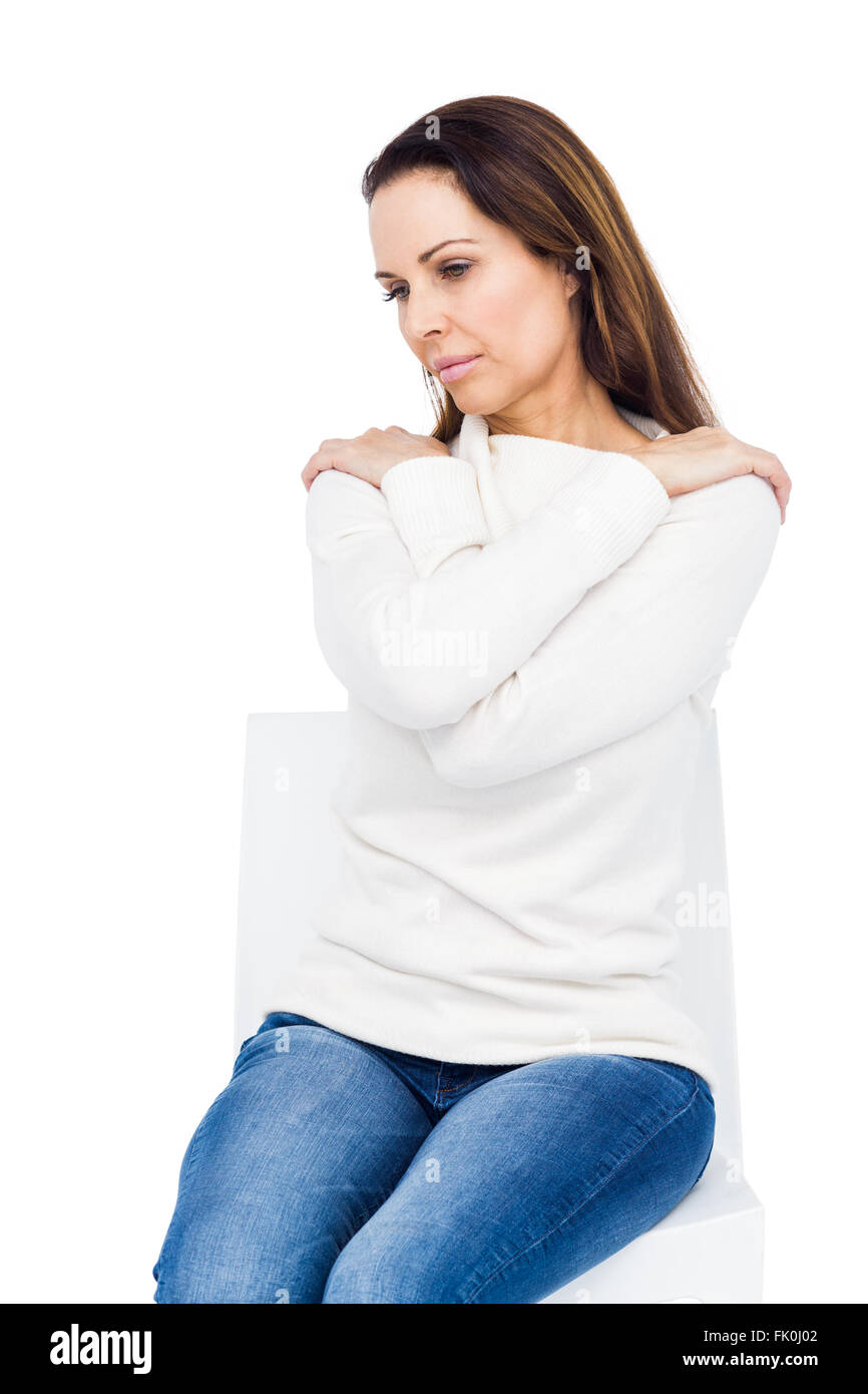 Desperate woman crossing arms on shoulders on white background Stock ...