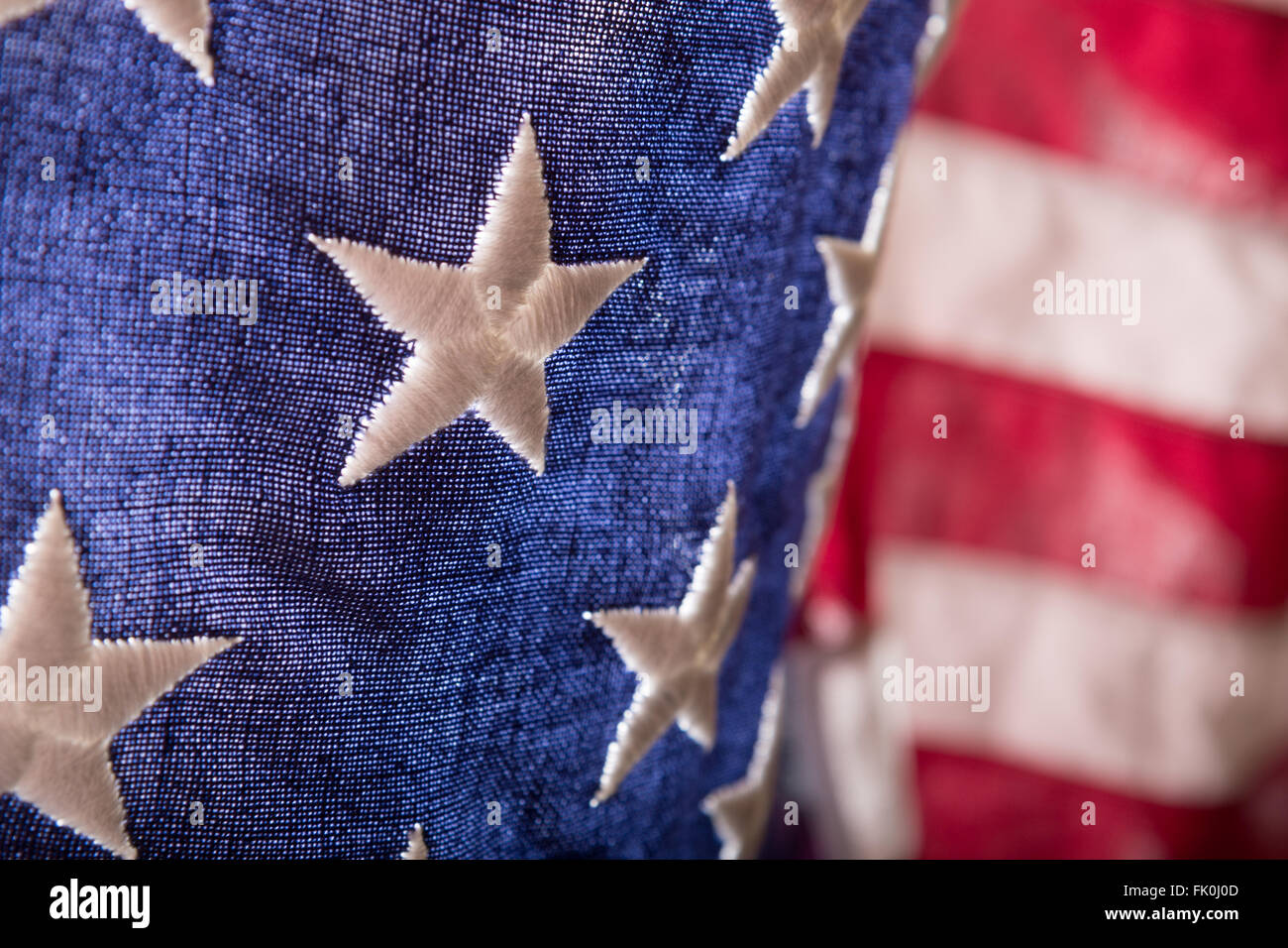 Back lit American Flag with Vibrant Colors showing stitching and fabric ...