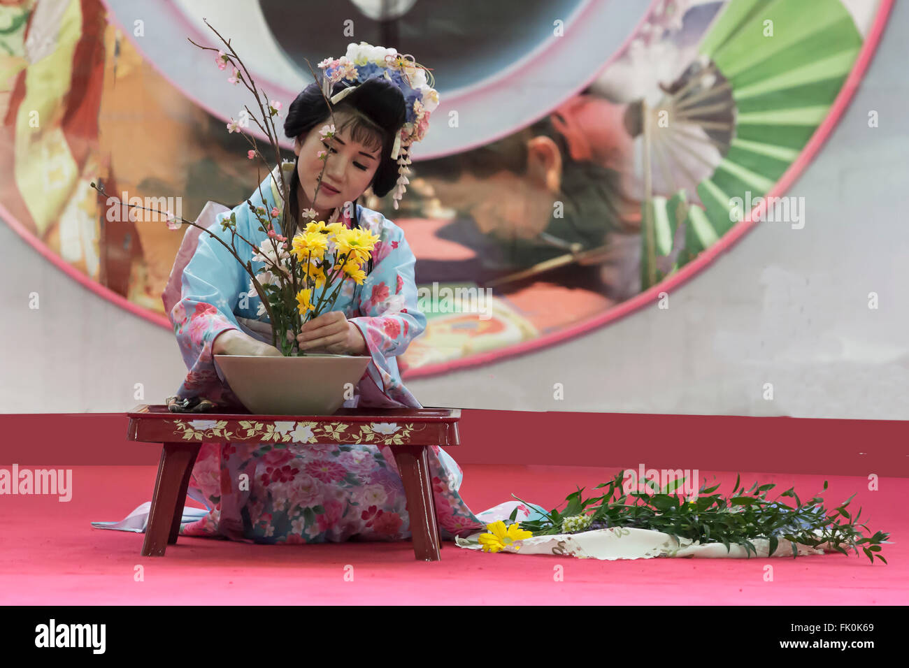 Geisha perforMS an ikebana ceremony at the Oriental festival in Turin ...