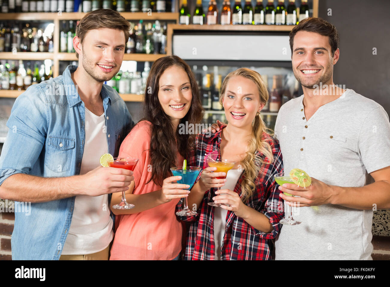 Friends toasting with cocktails Stock Photo - Alamy