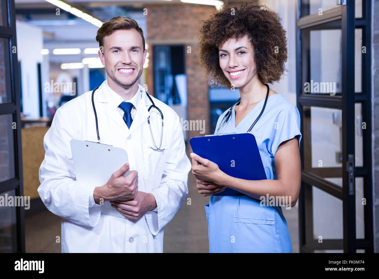 Doctors standing together clipboard hi-res stock photography and images ...