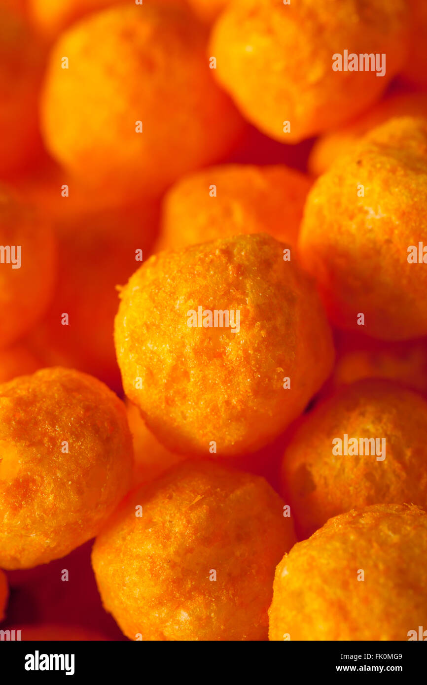 Unhealthy Cheesy Cheese Puffs in a Bowl Stock Photo - Alamy