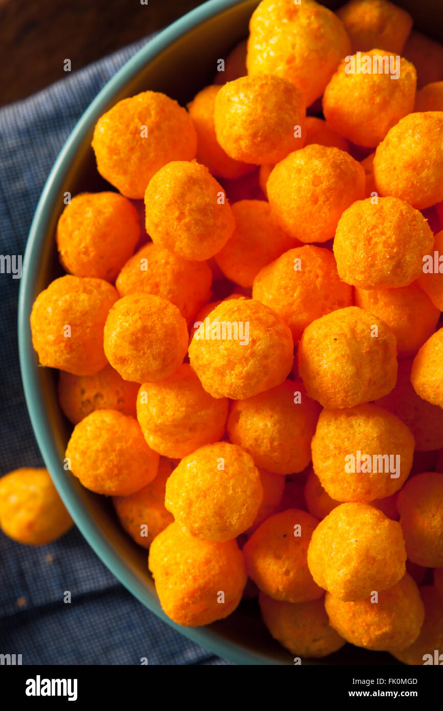 Unhealthy Cheesy Cheese Puffs in a Bowl Stock Photo - Alamy