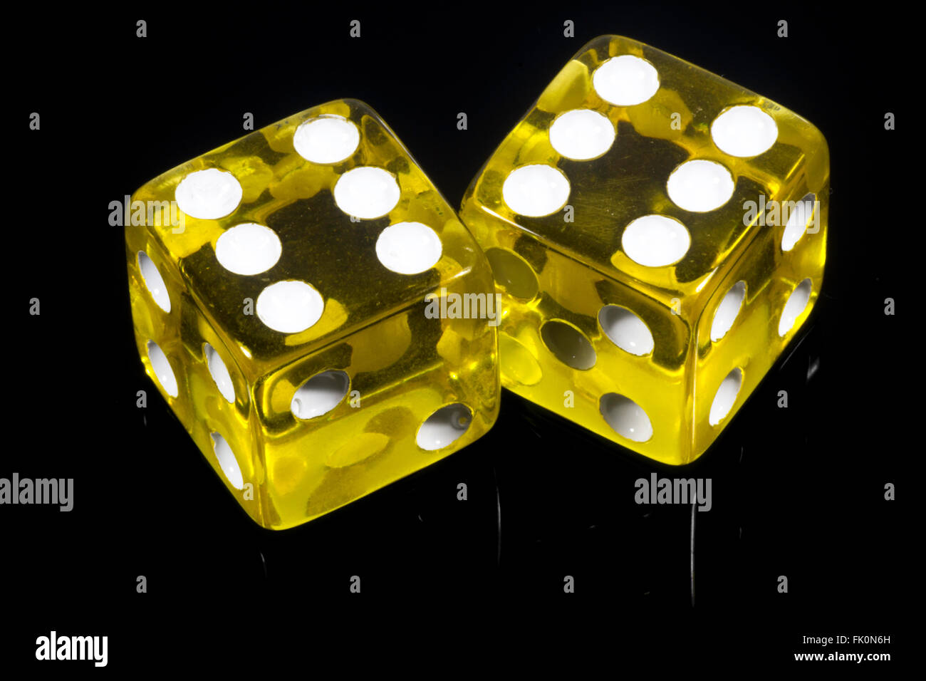 Yellow dice hi-res stock photography and images - Alamy