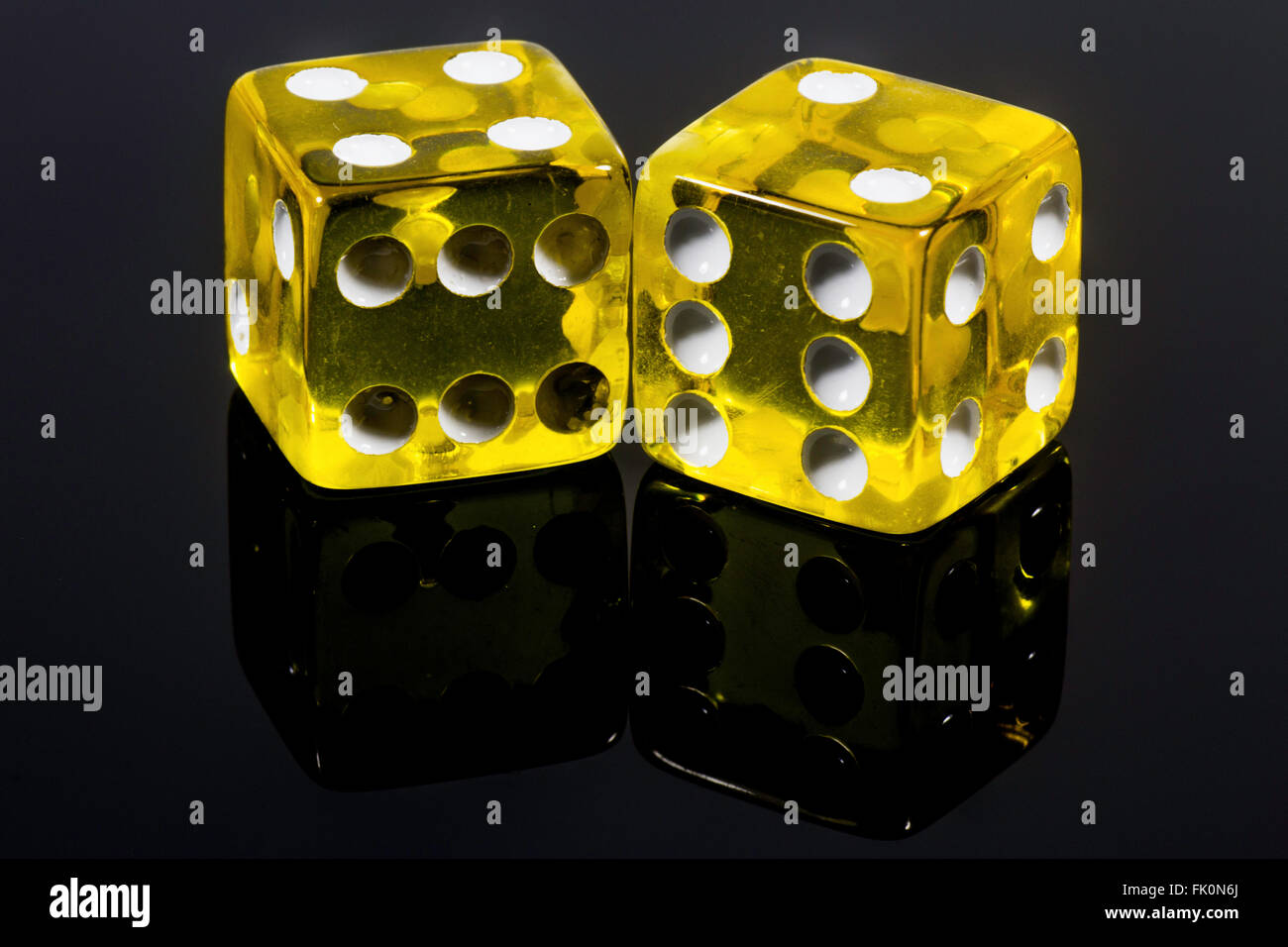 Yellow dice hi-res stock photography and images - Alamy