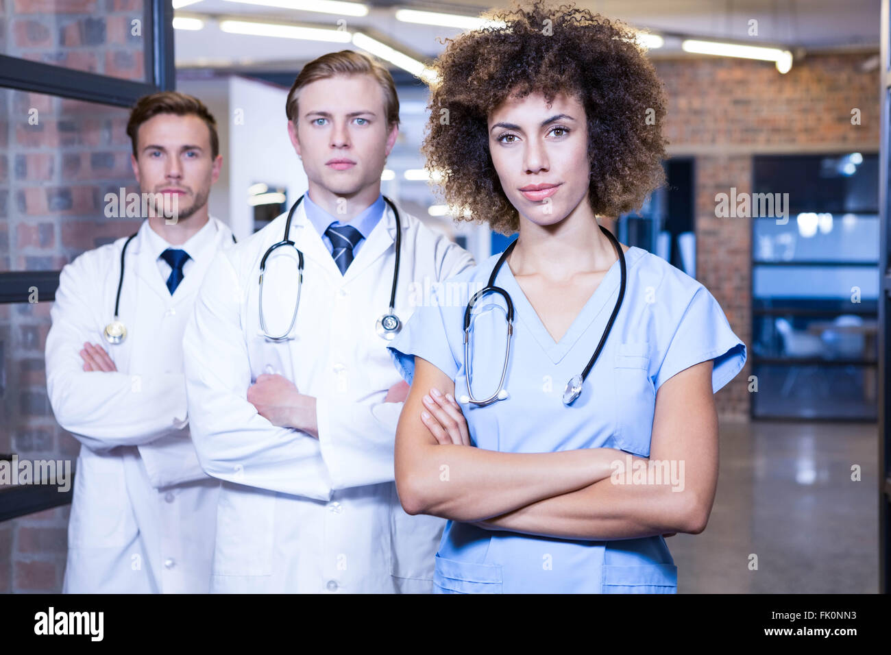 Portrait of medical team standing with arms crossed Stock Photo - Alamy