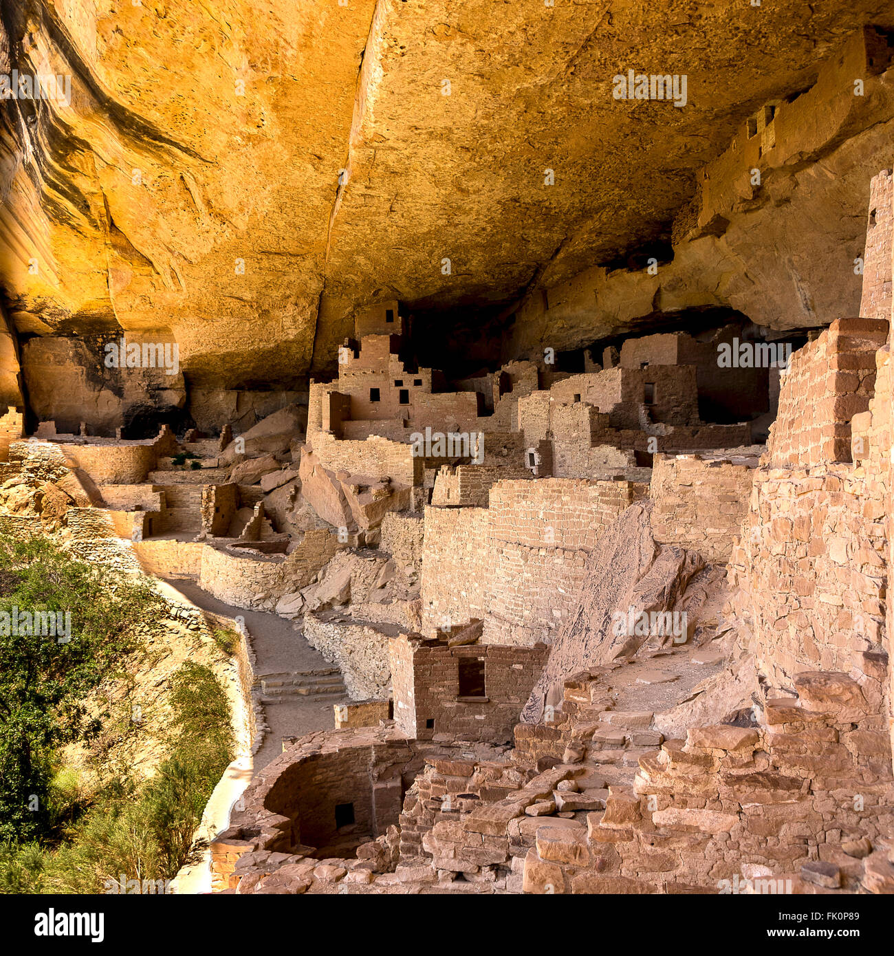 Cliff Dwelling Under a Shelf of Rock Stock Photo - Alamy