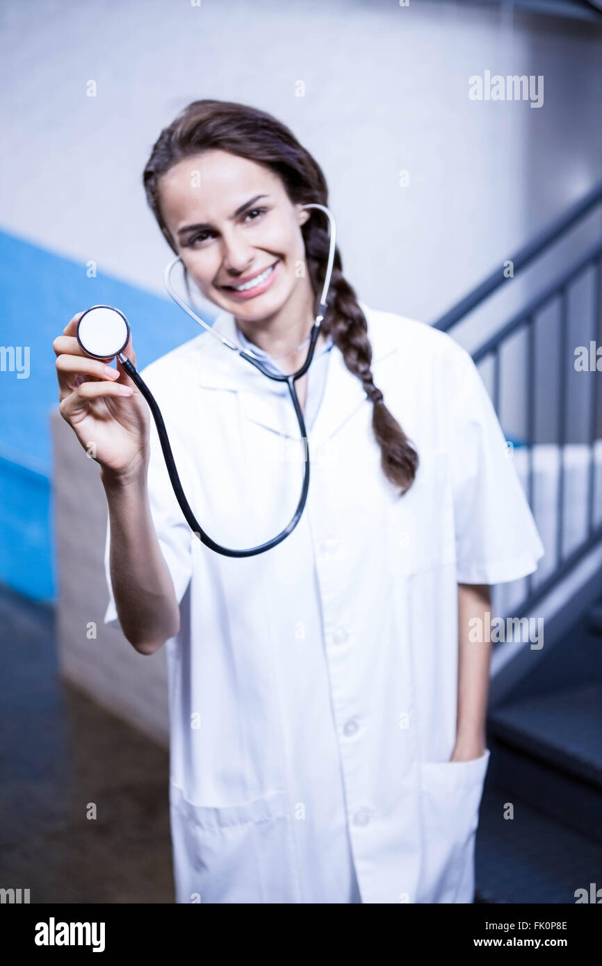 Portrait of female doctor showing stethoscope Stock Photo - Alamy