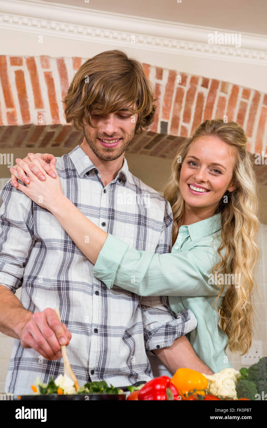 Cute couple cooking together Stock Photo - Alamy