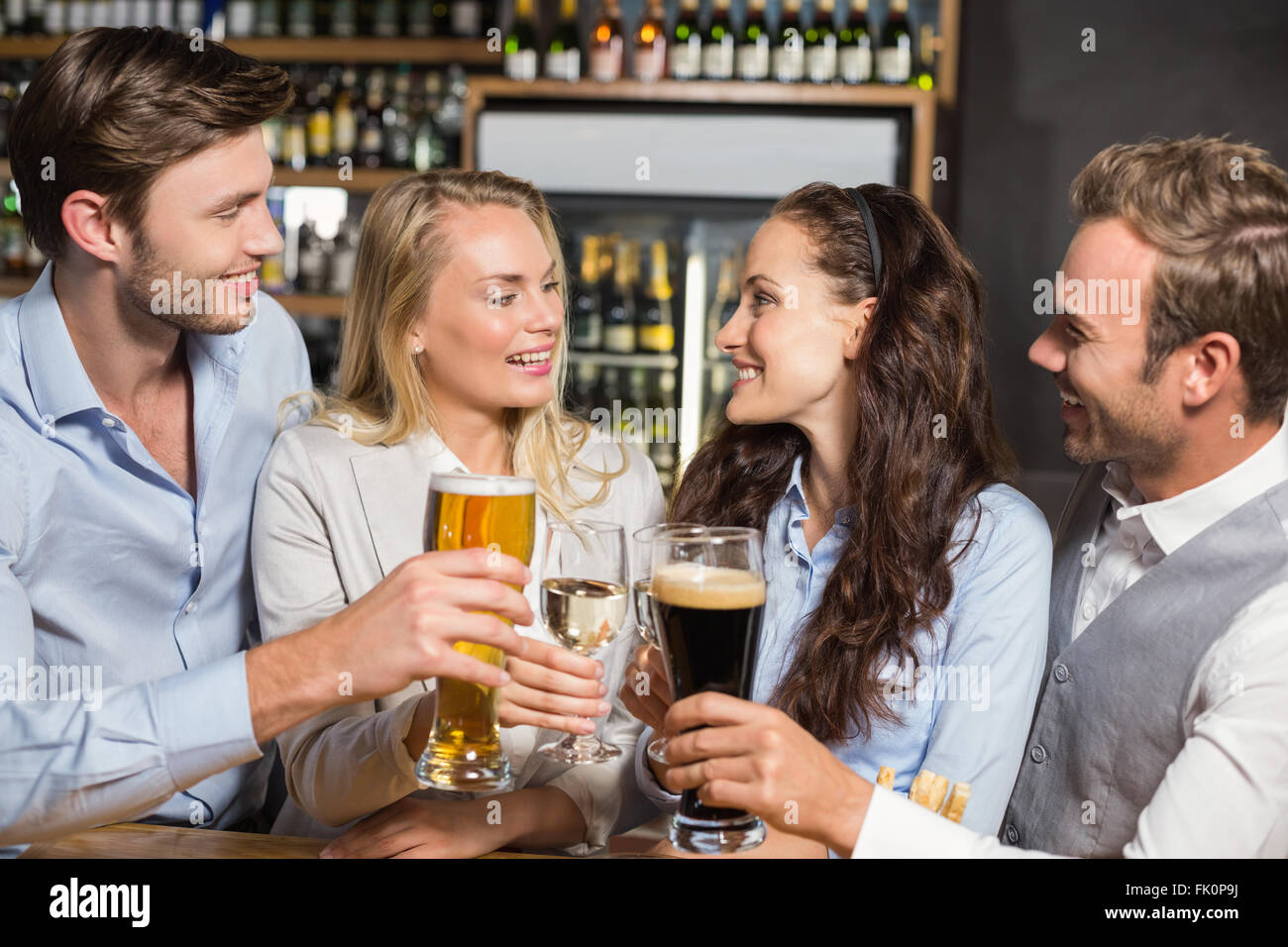 Friends toasting with beverages Stock Photo - Alamy