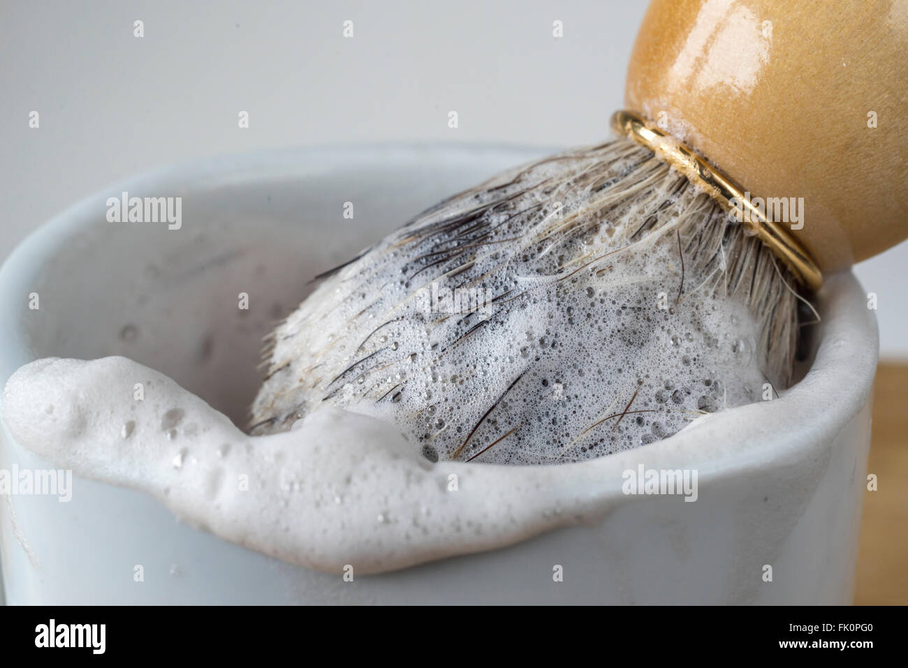 Shaving brush and bowl with foaming soap Stock Photo - Alamy