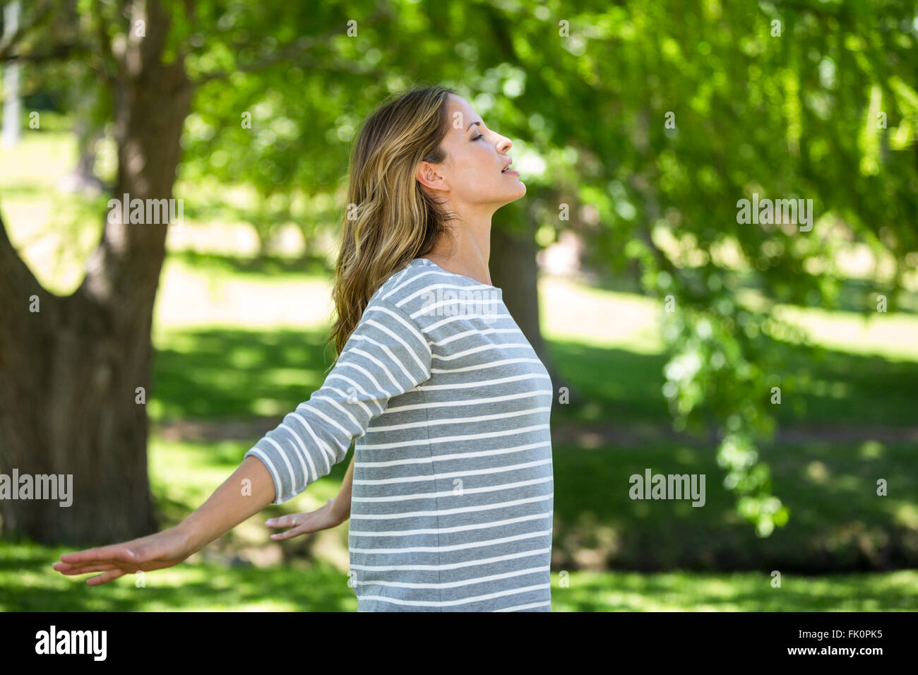 Woman stretching out her arms Stock Photo - Alamy