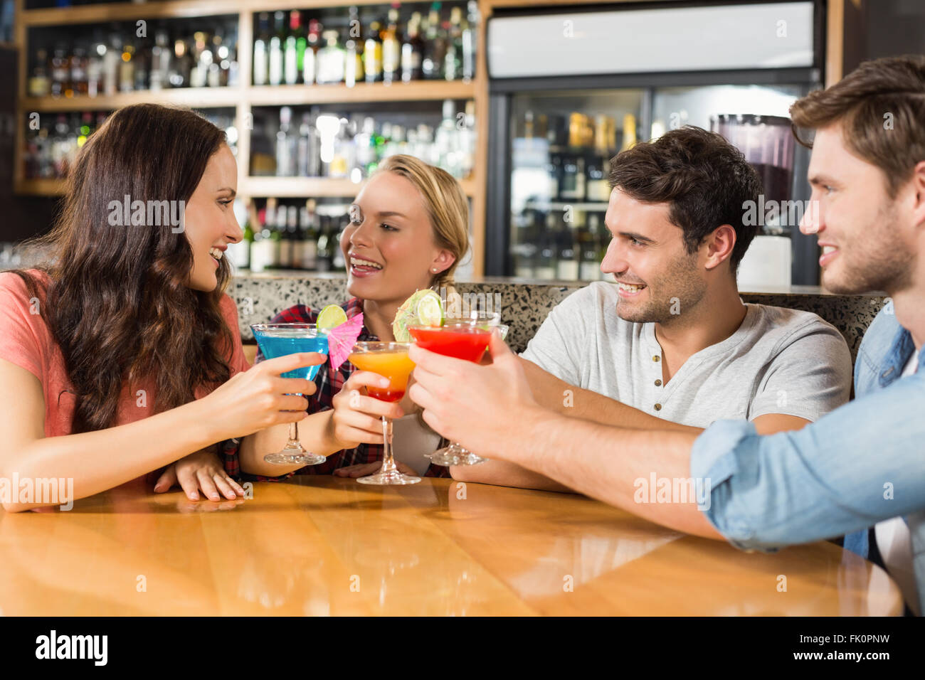 Friends toasting with cocktails Stock Photo - Alamy