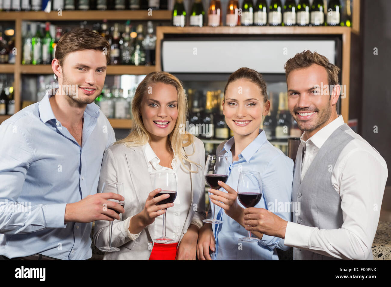 Friends toasting drinking red wine hi-res stock photography and images ...