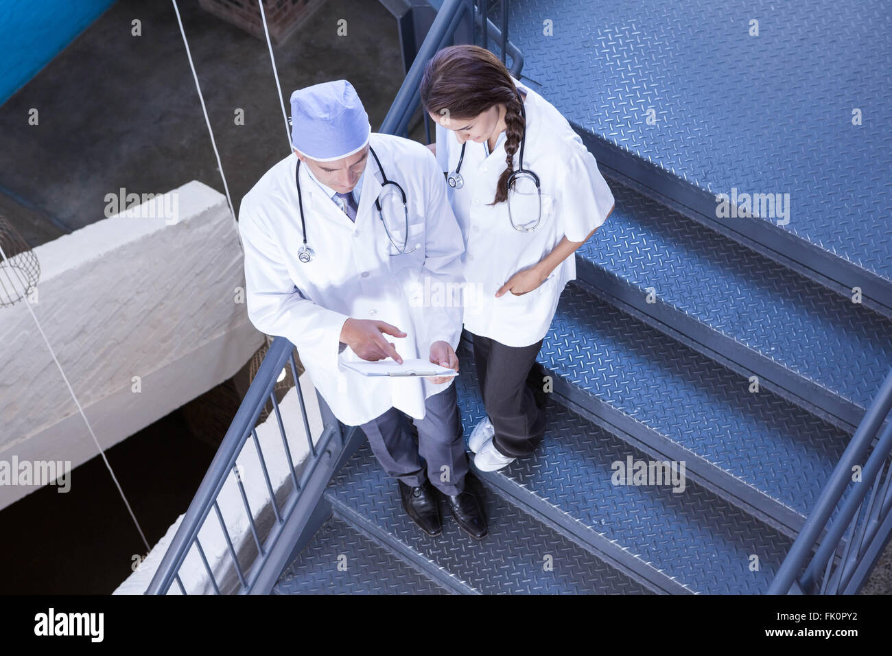 Doctors checking a medical report Stock Photo - Alamy