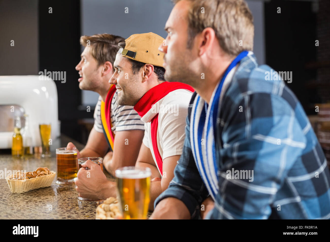 Men watching a game on tv Stock Photo - Alamy