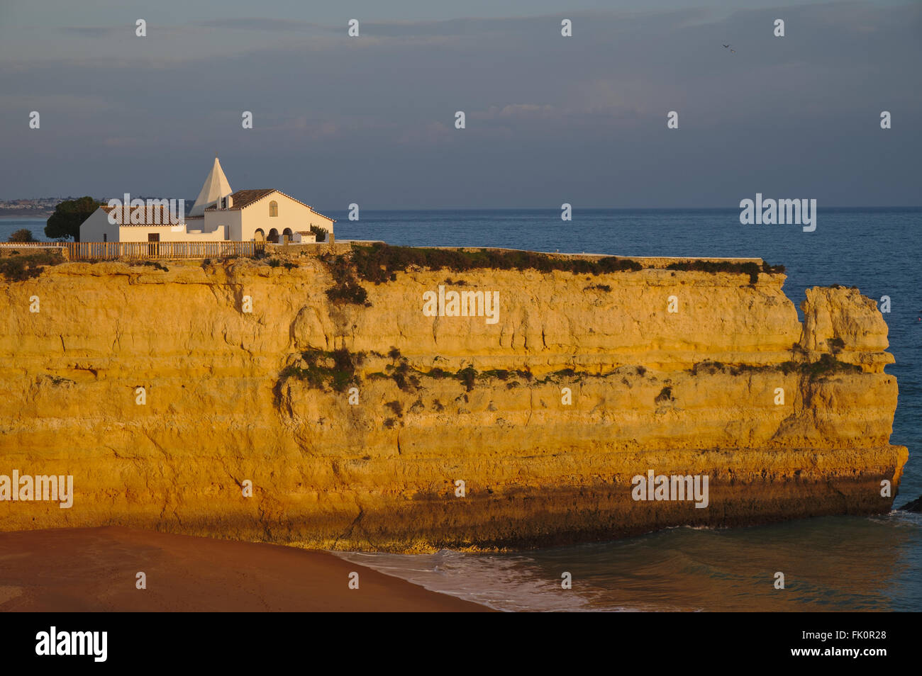 Chapel Nossa Senhora da Rocha on the cliffs in Lagoa, Algarve, Portugal ...