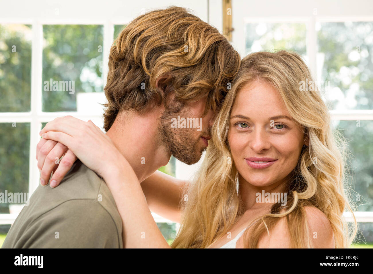Cute couple hugging Stock Photo - Alamy