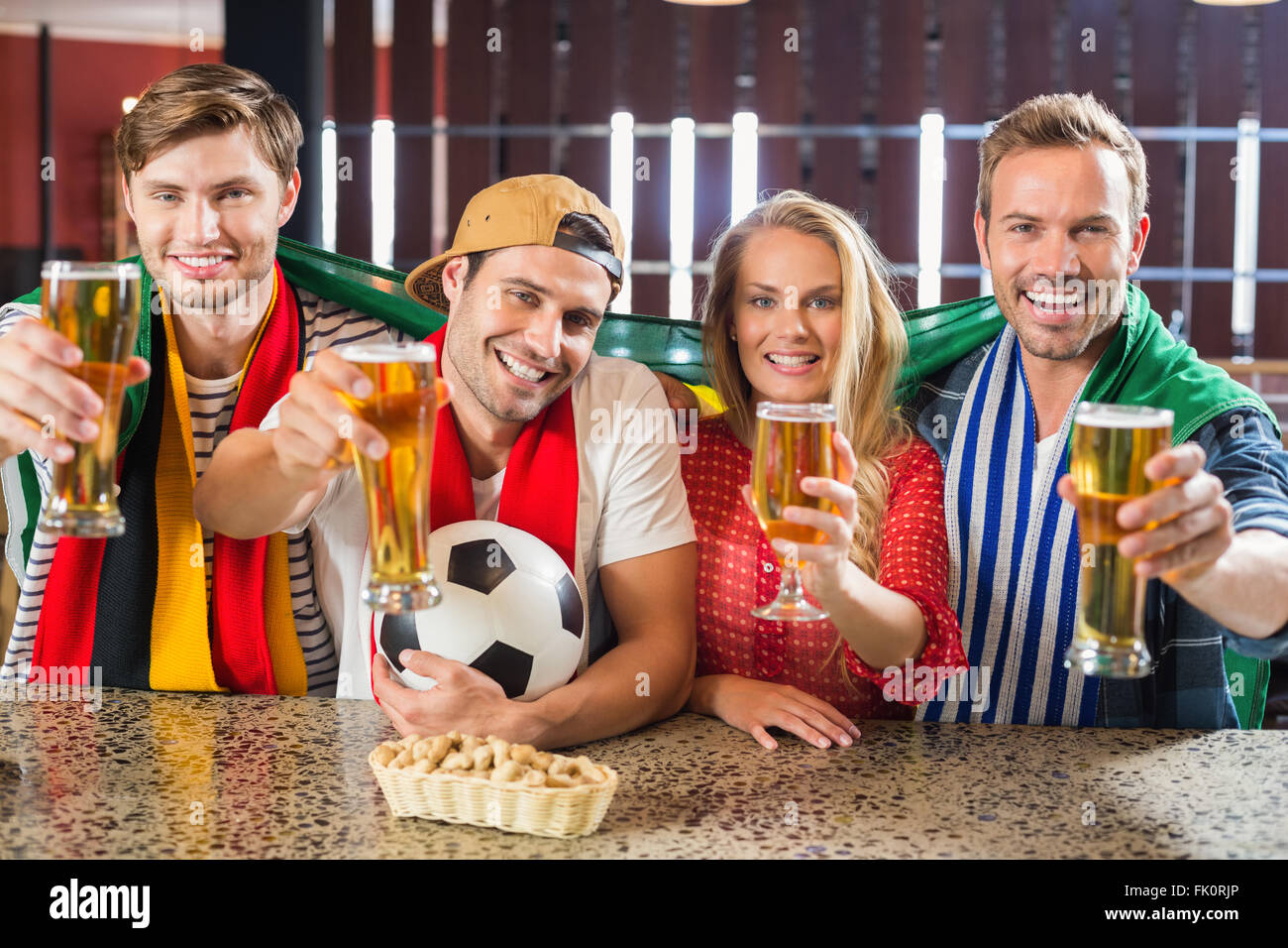 Friends toasting with beers Stock Photo - Alamy